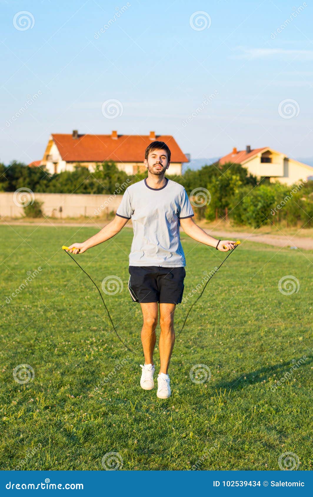 Man Exercising with Jumping Rope Stock Photo - Image of active, field ...