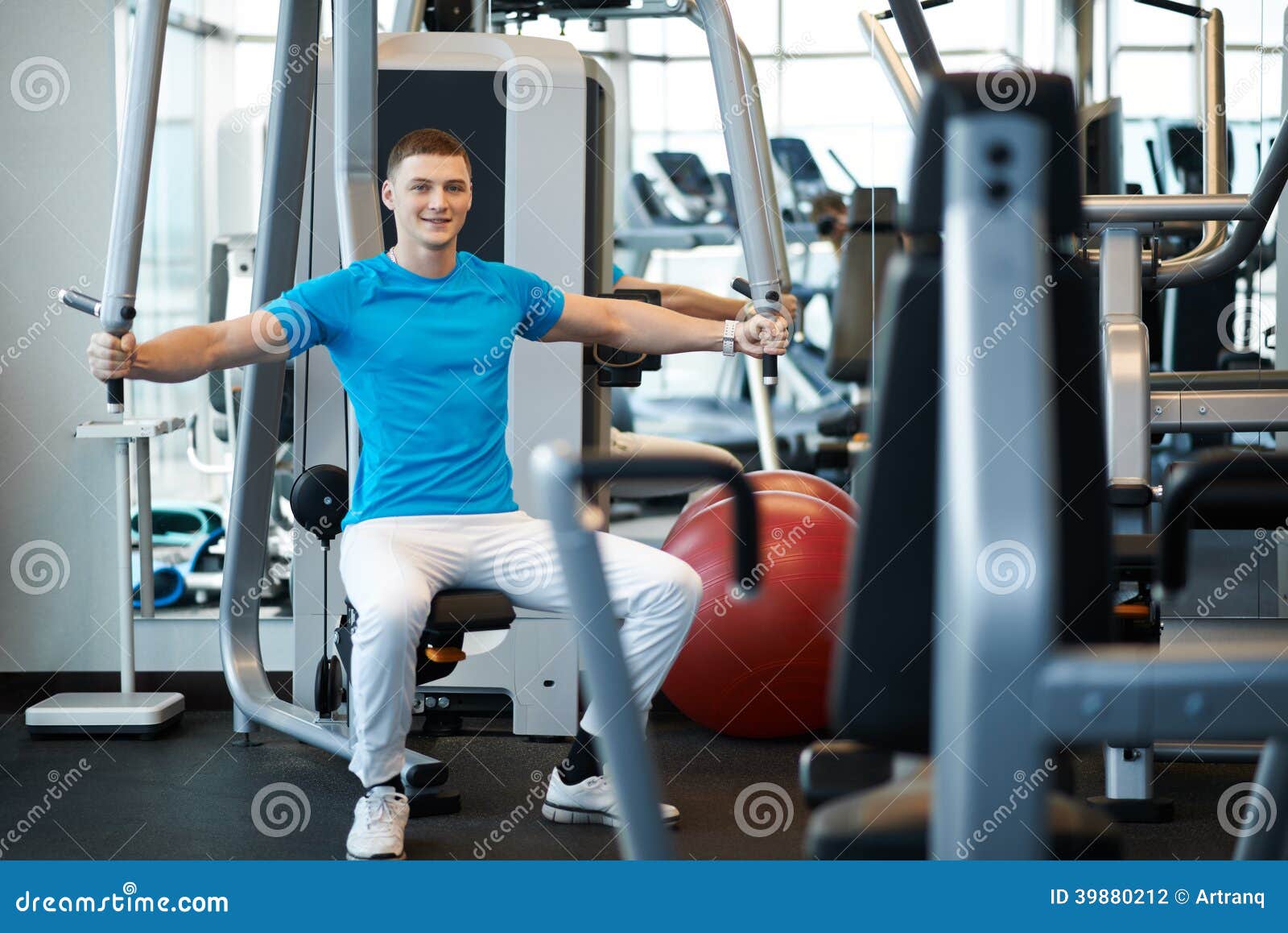 Man Exercising in Trainer for Pectoral Muscles Stock Photo - Image of ...