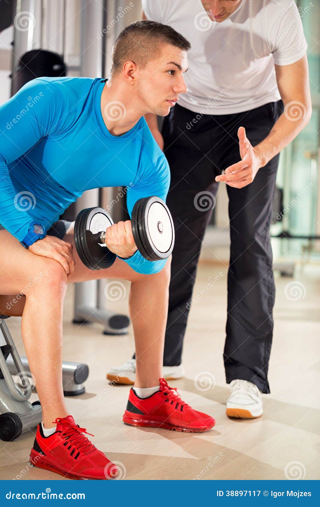 Man Exercising Under Supervision Trainer Stock Image - Image of heavy ...