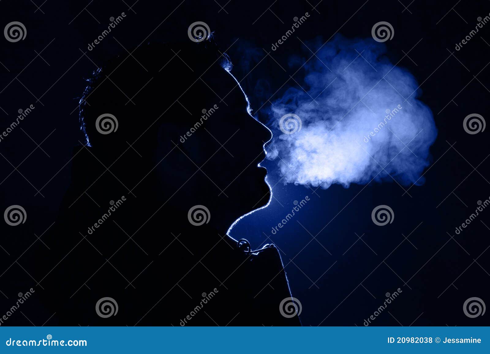 Man exhaling warm breath stock photo. Image of dark, blue - 20982038