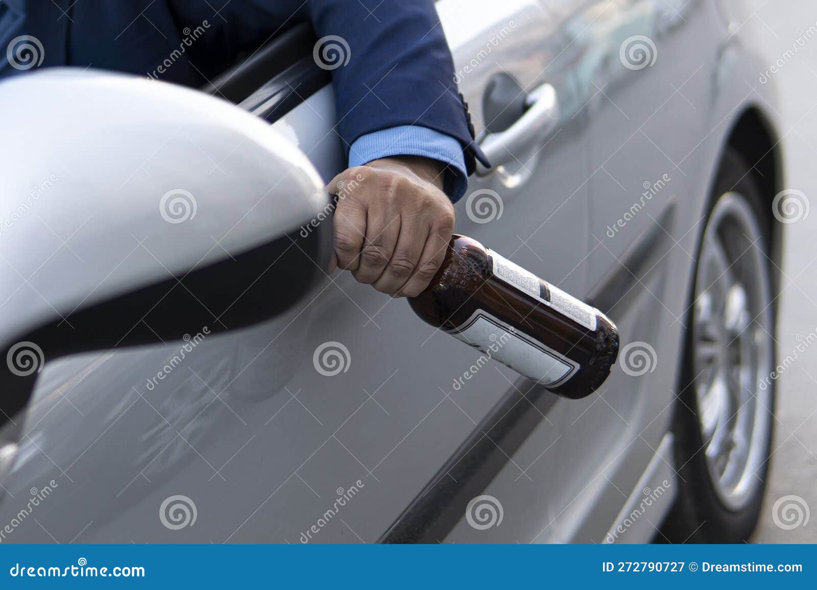 Boy Throws Out A Bottle In A Green Container Designed For Glass Waste ...