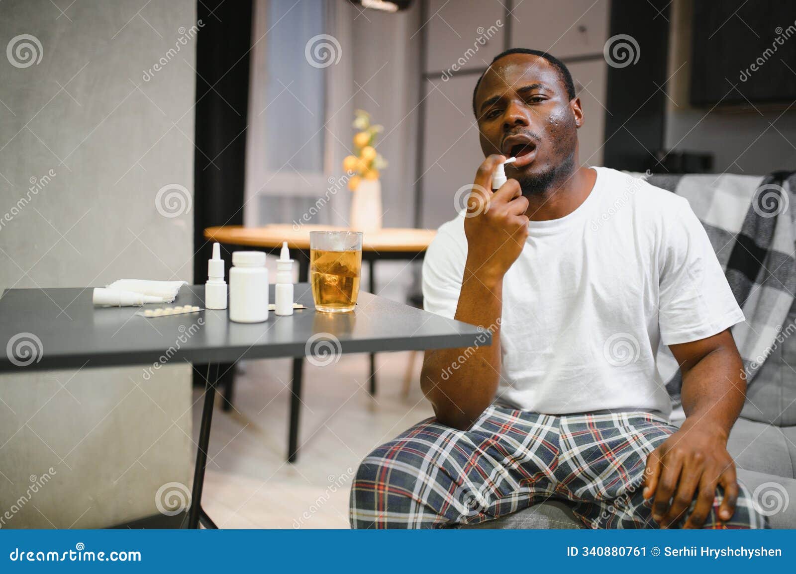 Man Experiencing Sore Throat Pain Using Throat Spray for Relief on ...