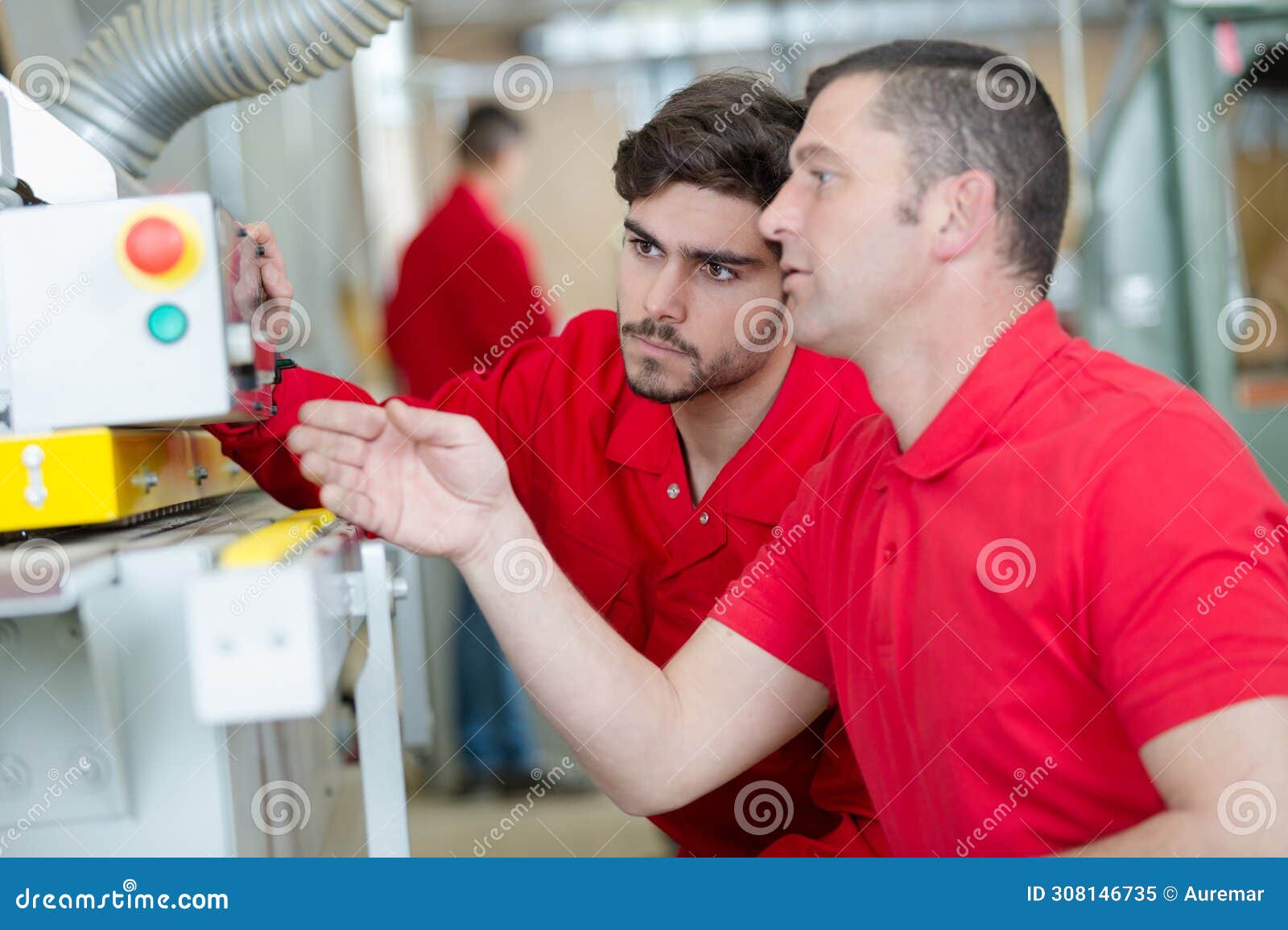 Man Explaining Controls Industrial Machine To Younger Worker Stock ...