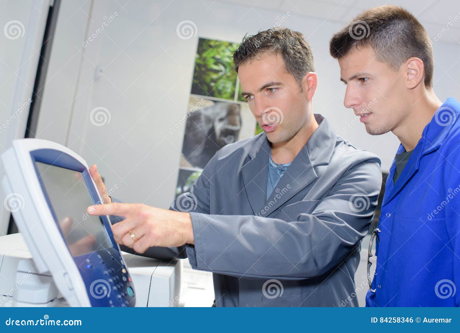 Man Explaining Controls Machine To Apprentice Stock Photo - Image of ...