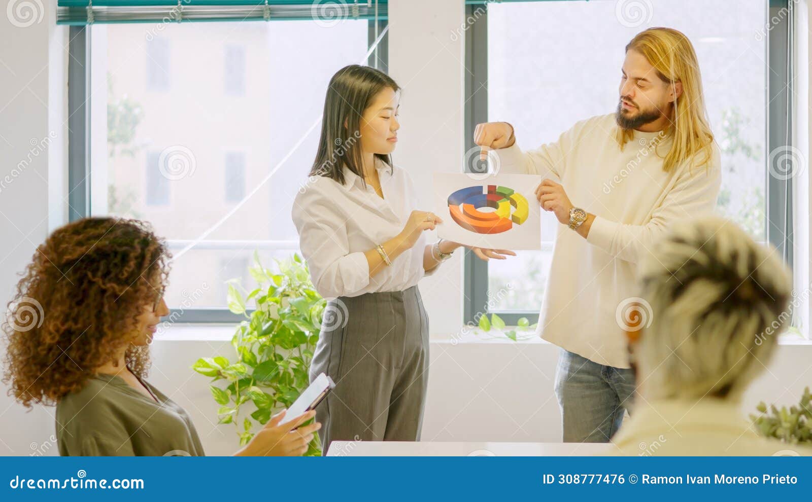 Man Explaining an Idea Using a Graphic during a Meeting Stock Photo ...