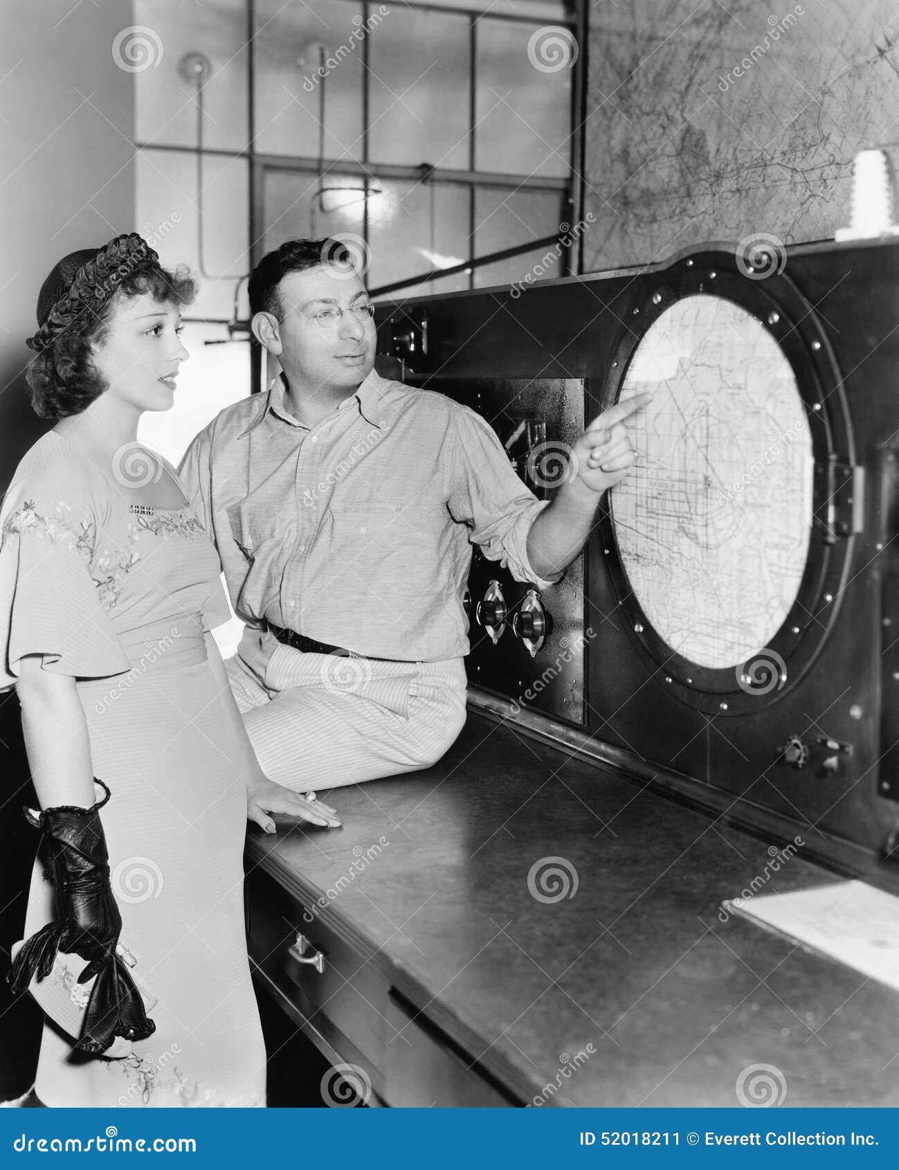 Man Explaining about Radar To a Young Woman in a Control Room Stock ...