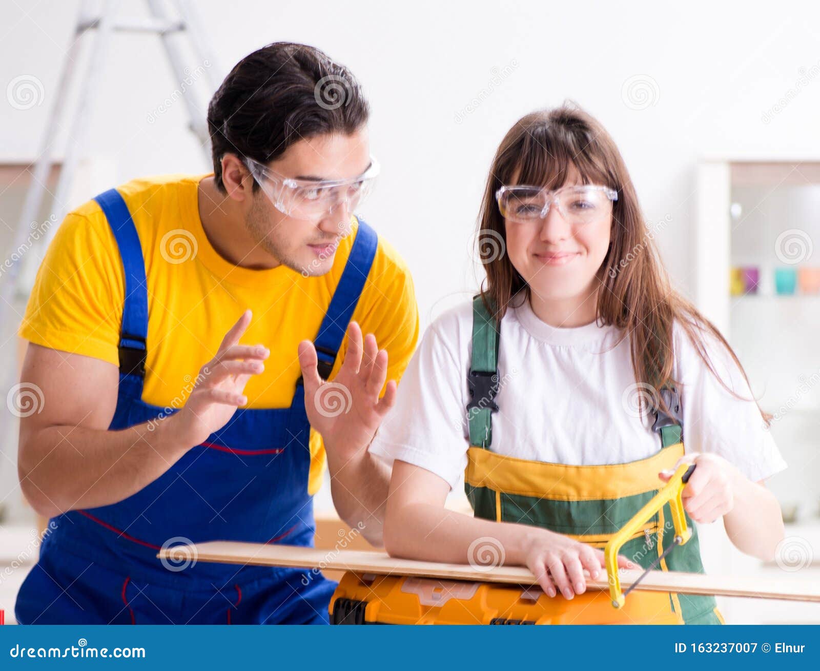 Man Explaining Woman Woodworking Tips in Wood Workshop Stock Image ...
