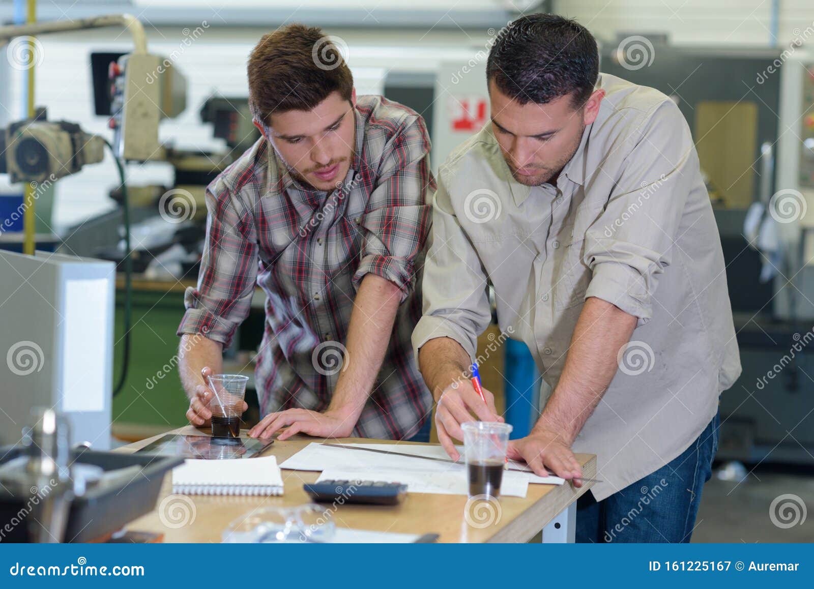 Man Explaining Working Machine To Trainee Stock Image - Image of ...