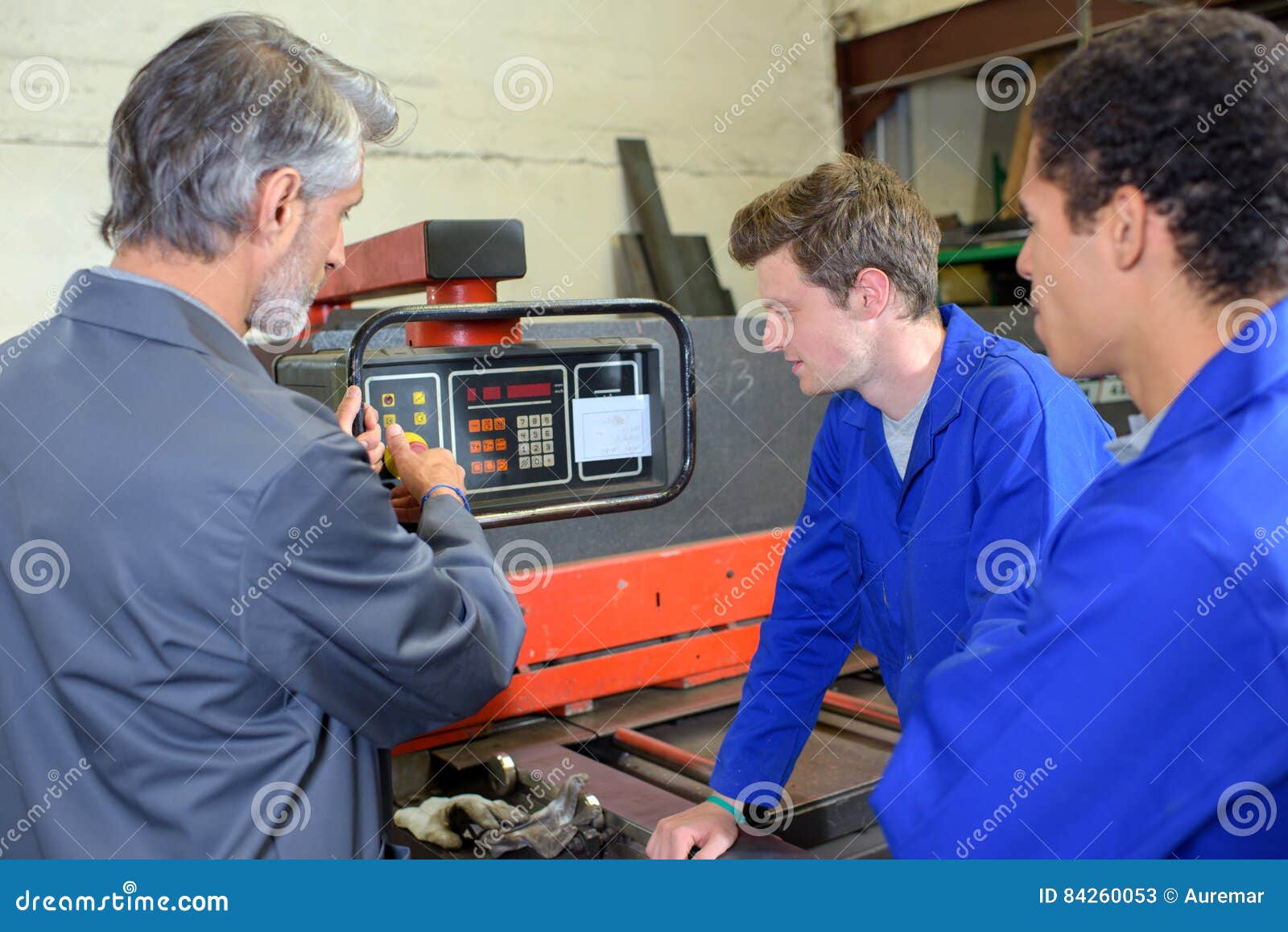 Man Explaining Workings Machine To Two Students Stock Image - Image of ...