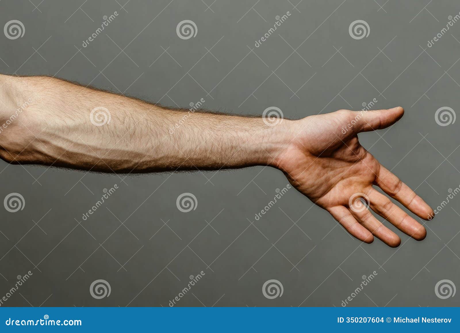Man Extending Hand and Arm on Gray Background Stock Photo - Image of ...