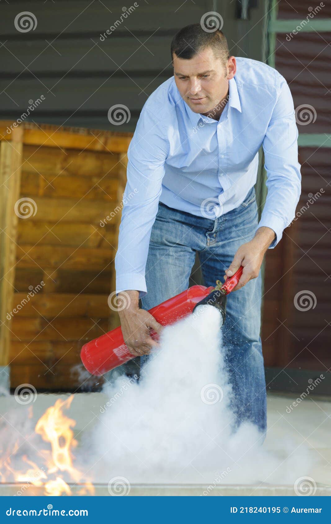 Man Extinguishing Controlled Fire during Training Exercise Stock Image ...