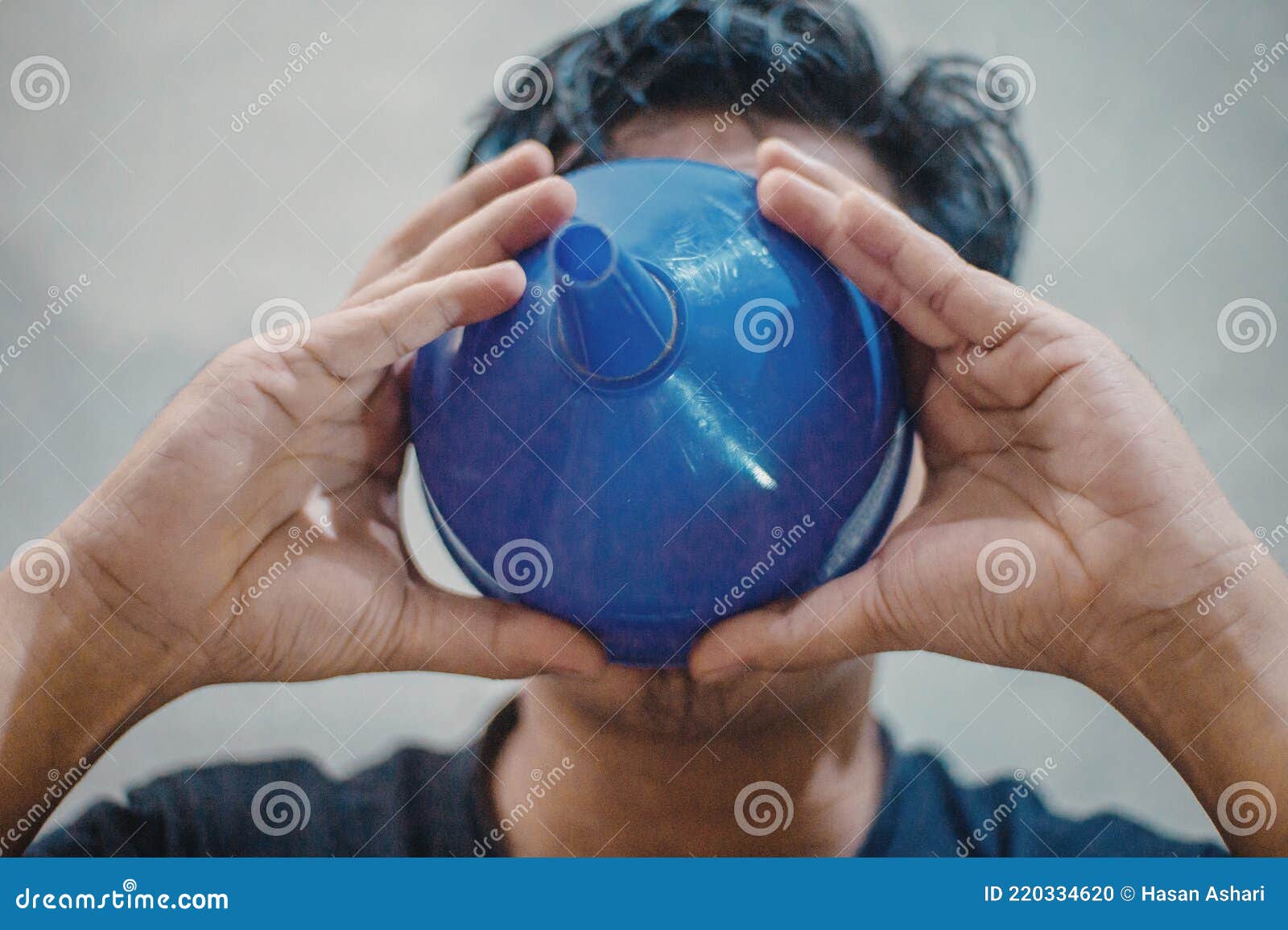 A Man with a Face Covered in a Blue Funnel Stock Photo - Image of nose ...