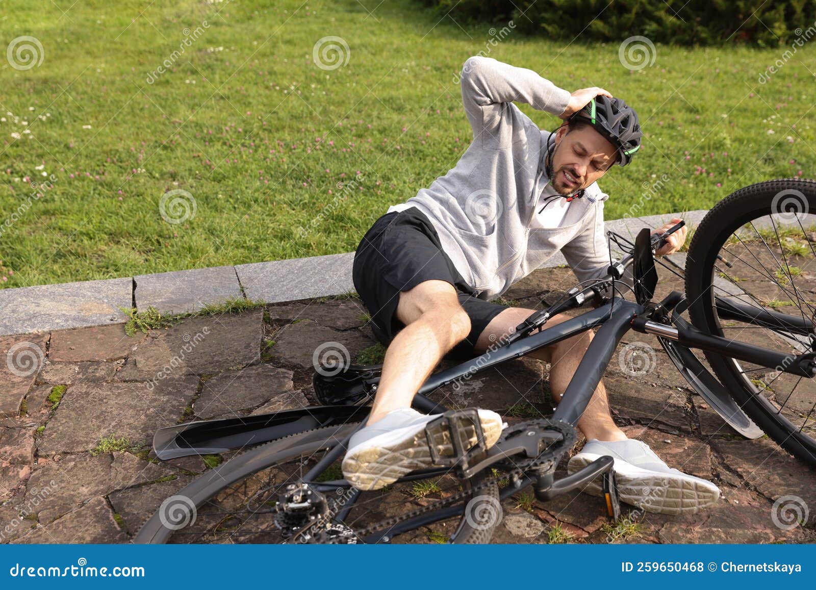 Man Fallen Off His Bicycle in Park Stock Photo - Image of park, leisure ...