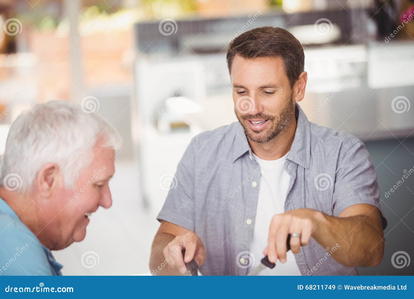 Man with father at home stock image. Image of domestic - 68211749