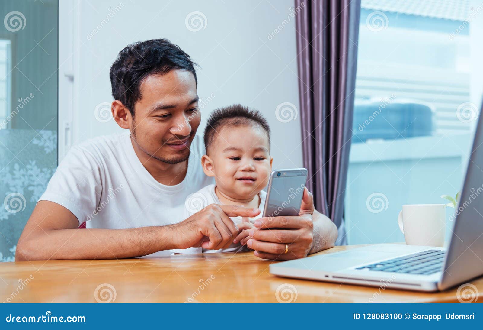 Man Father Working on Laptop Computer and Using Smartphone Techn Stock ...