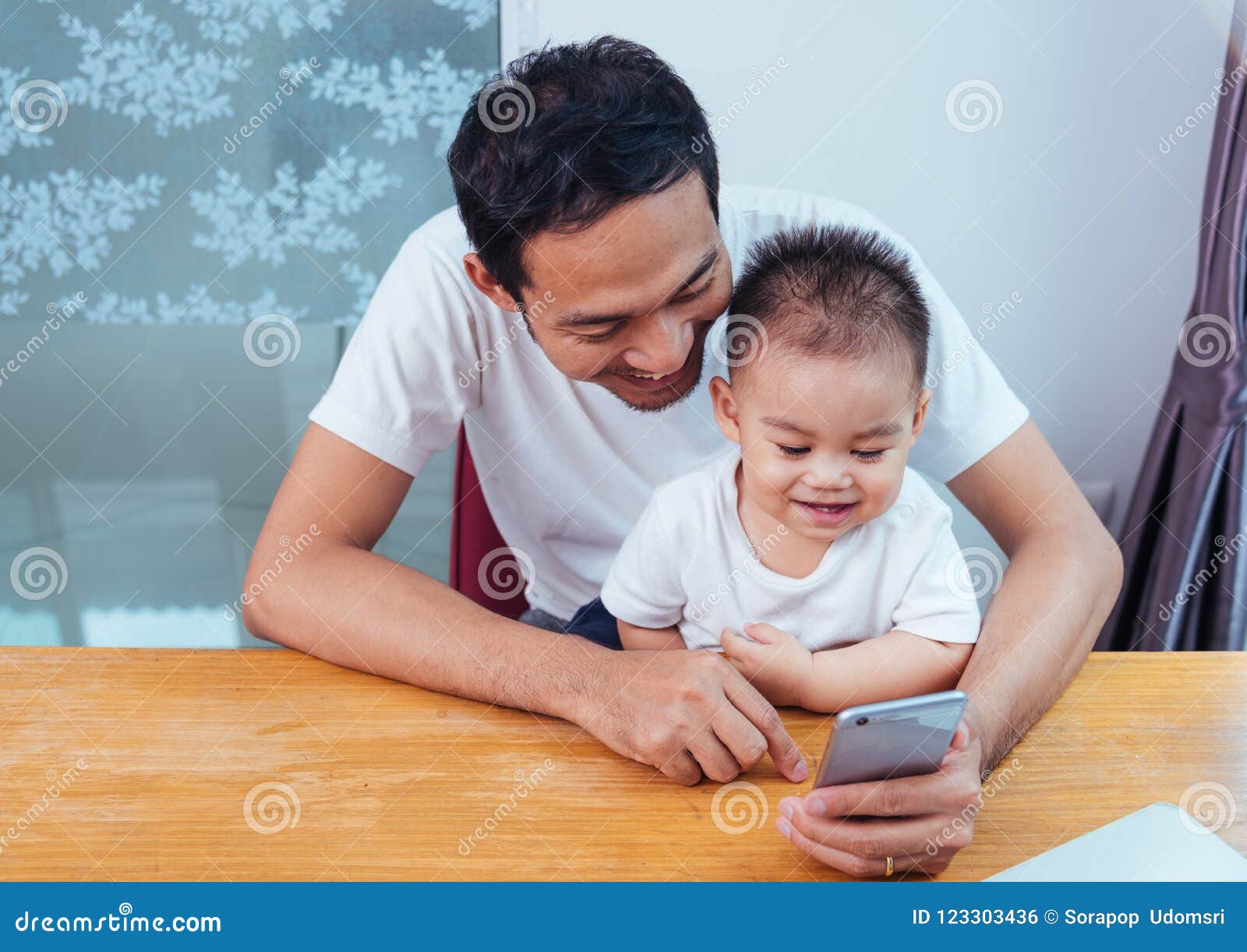 Man Father Working on Laptop Computer and Using Smartphone Techn Stock ...