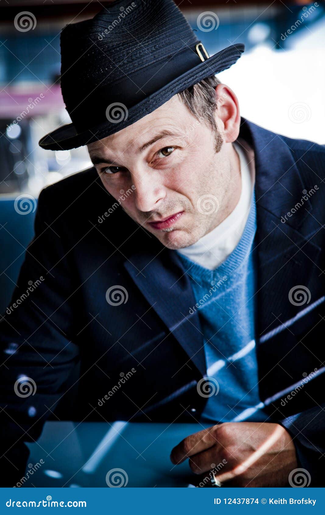 Man in Fedora Sitting in Diner Stock Photo - Image of peaceful ...