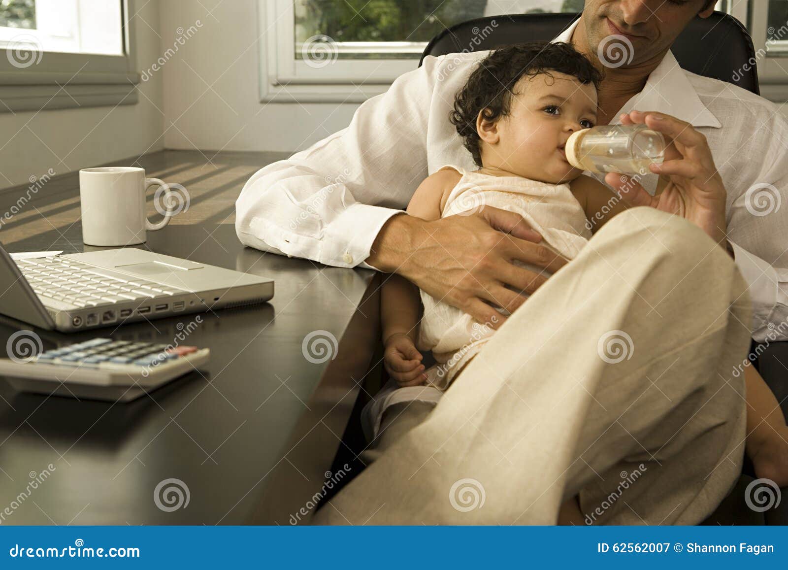 Man feeding baby stock image. Image of enjoying, feeding - 62562007