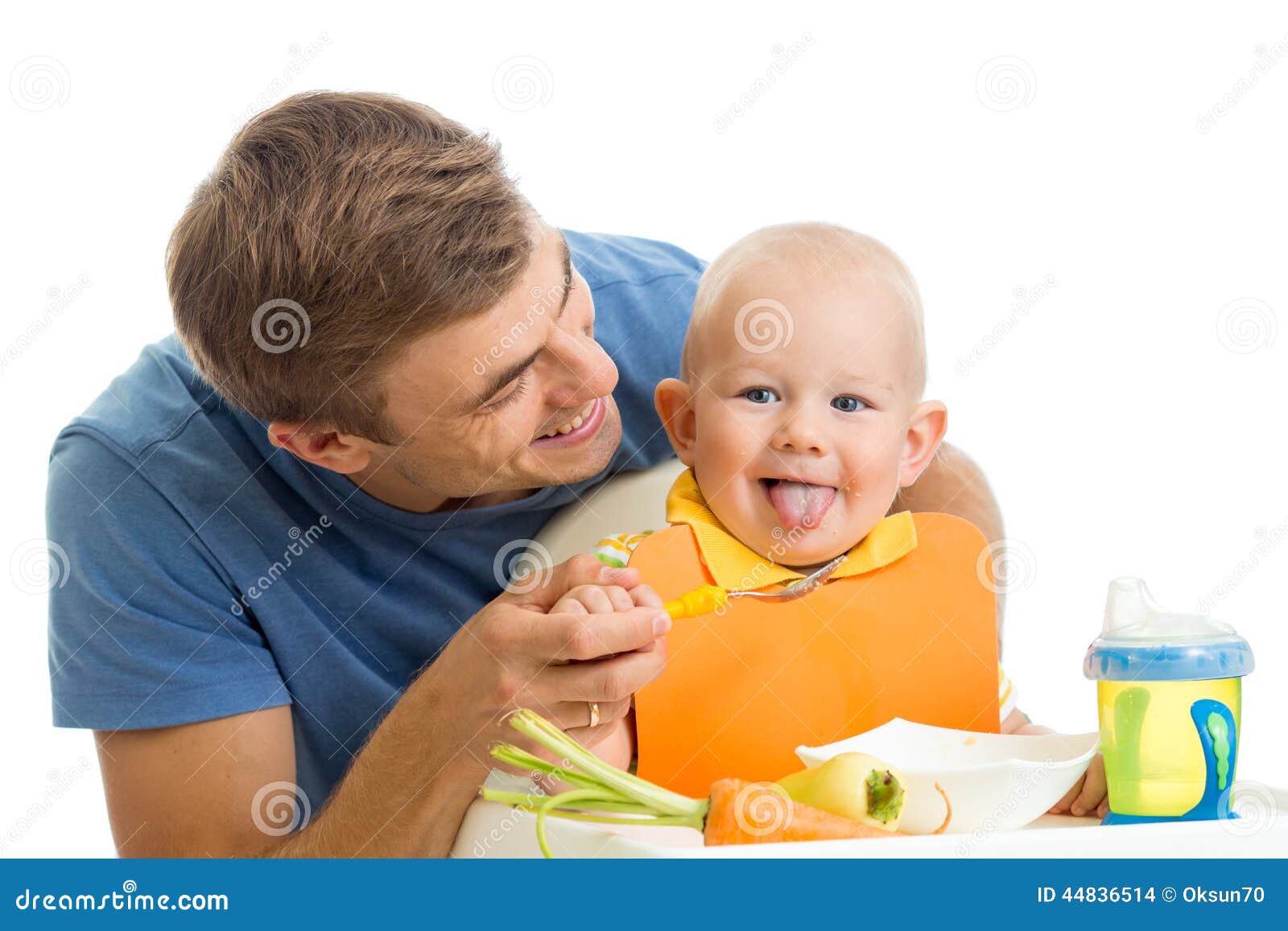 Man feeding his baby stock photo. Image of dinner, indoor - 44836514