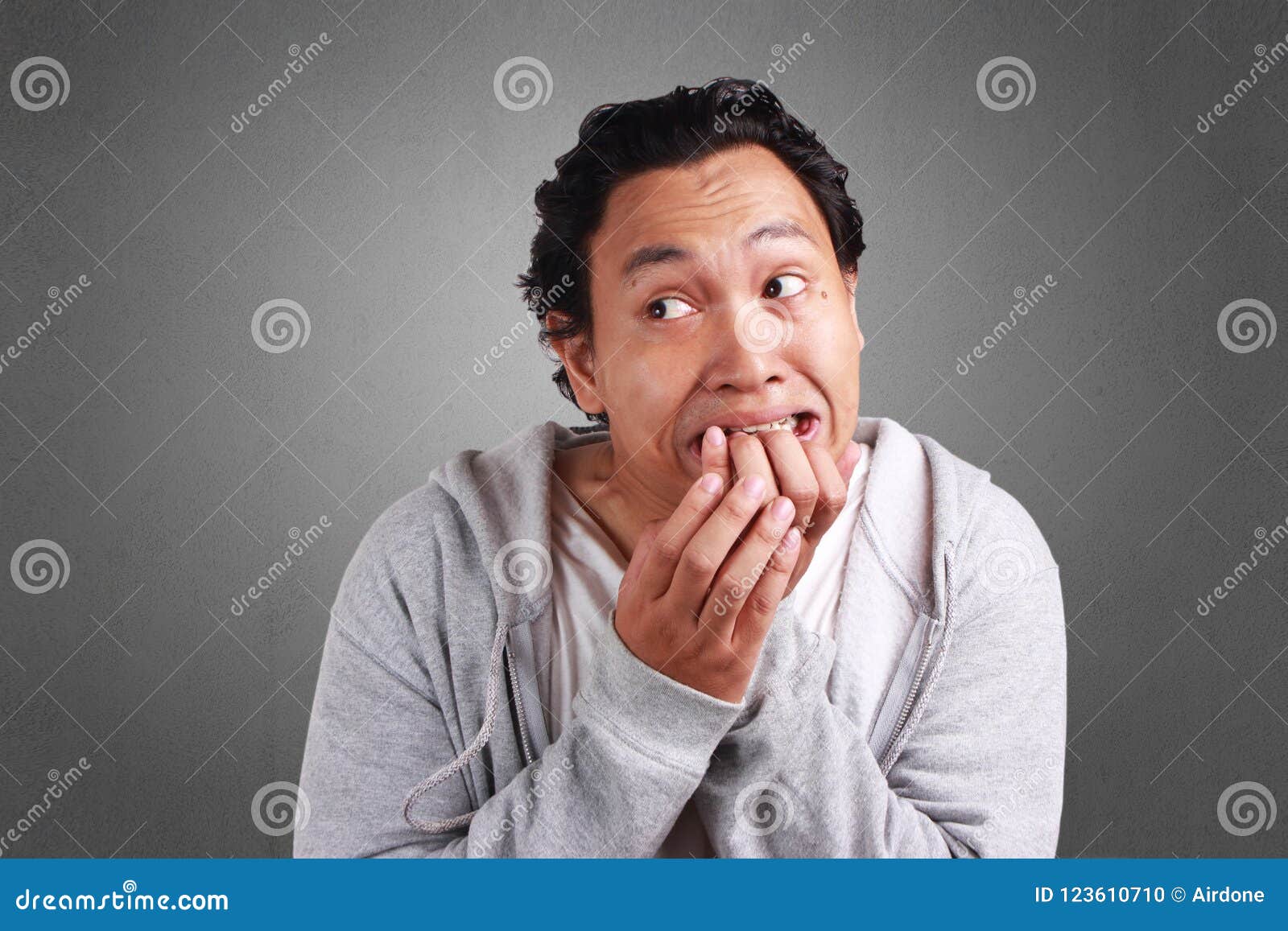 Man Feel Scared while Biting His Finger Stock Photo - Image of person ...