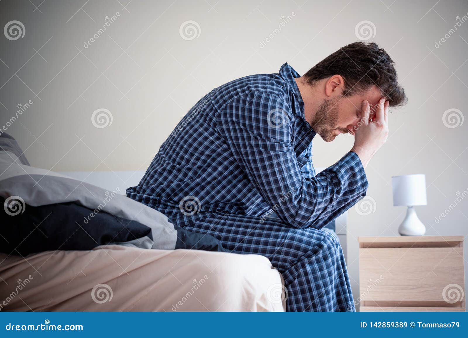 Man Feeling Bad and Seated on the Bed Stock Image - Image of migraine ...