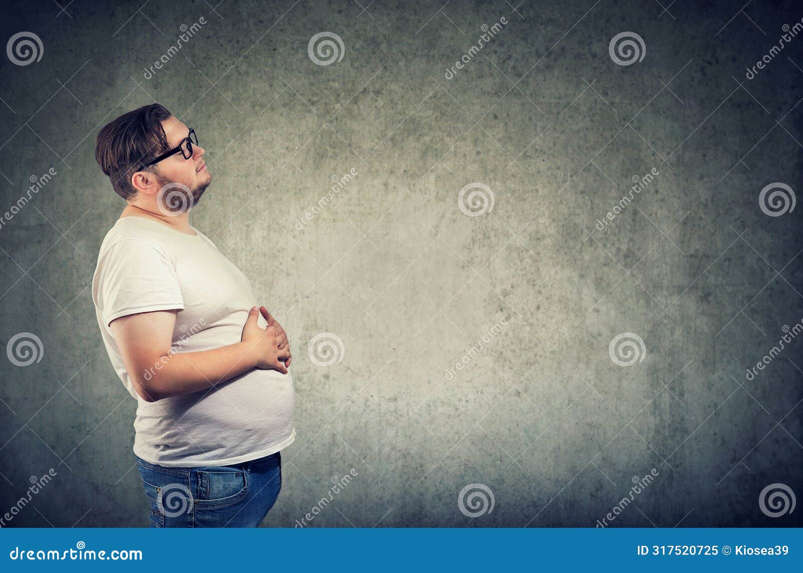 Man Feeling Bloated with Arms on Belly Stock Image - Image of bloated ...