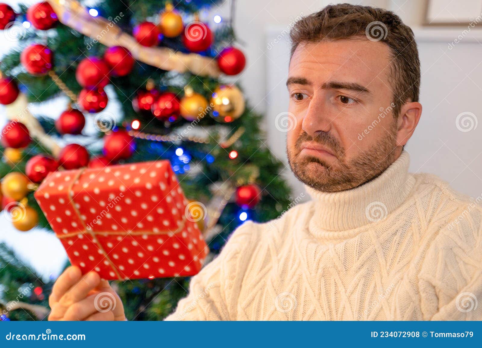 Man Feeling Disappointed for a Bad Christmas Present Stock Photo ...