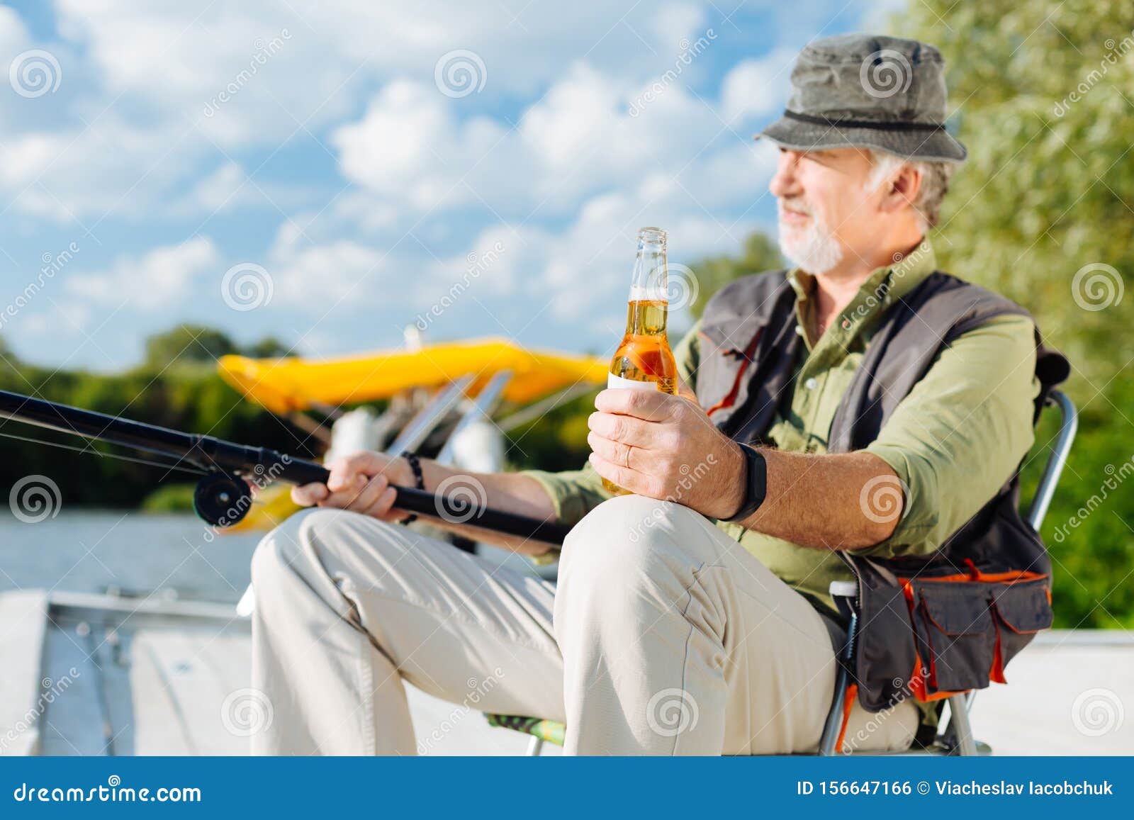 Man Feeling Relaxed while Drinking Beer and Fishing Stock Photo - Image ...
