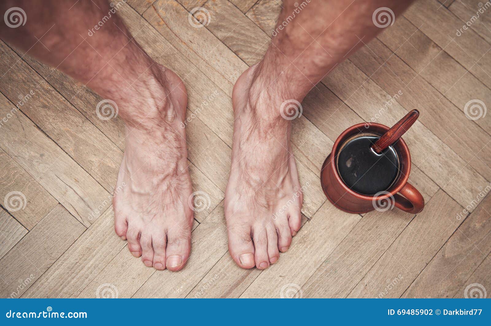 Man Feet on Floor and Cup of Coffee Stock Photo - Image of floor, feet ...