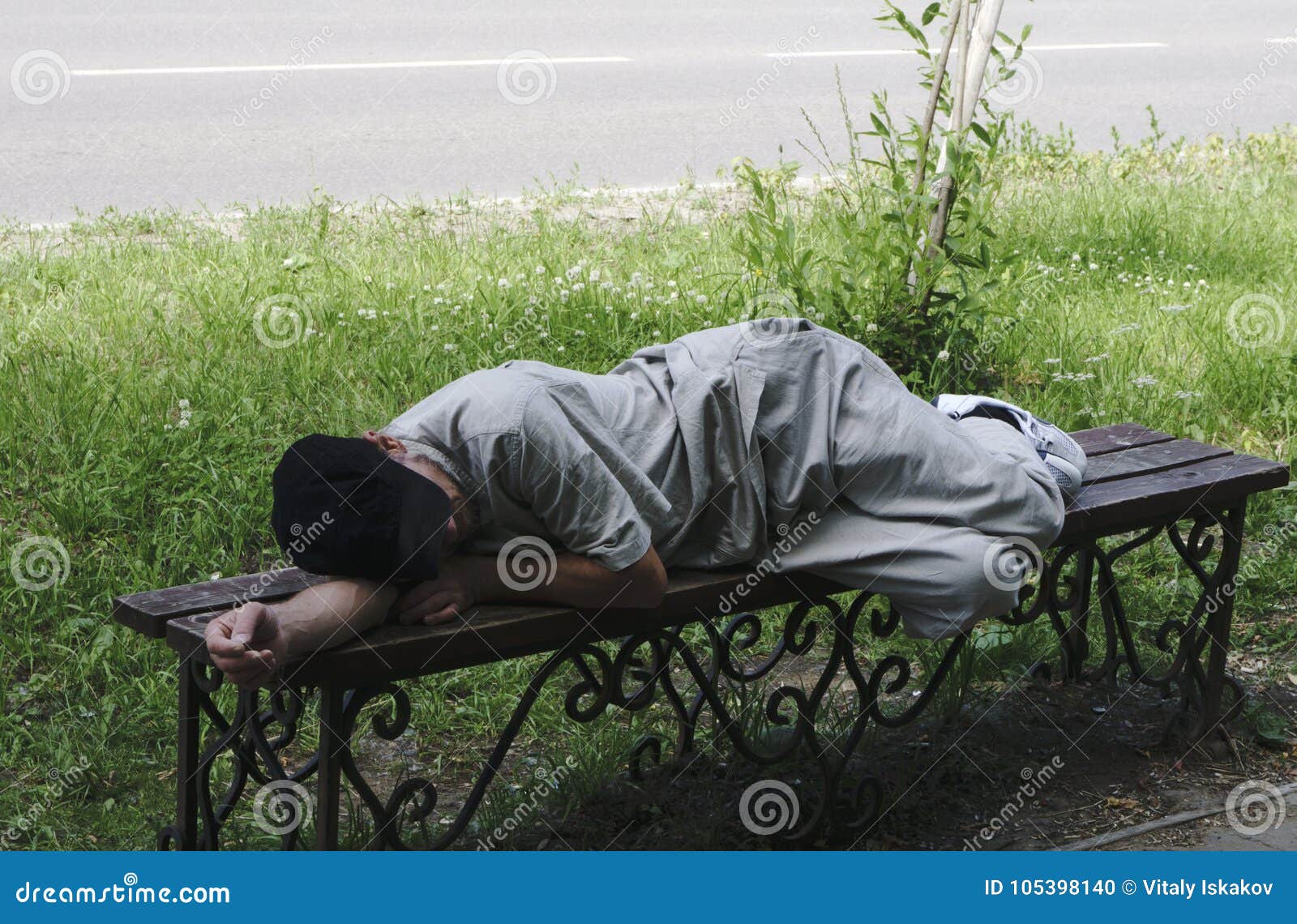 The Man Fell Asleep, Lying on the Wooden Seat, Covered His Face with a ... The Man Fell Asleep, Lying on the Wooden Seat, Covered His Face with a ...