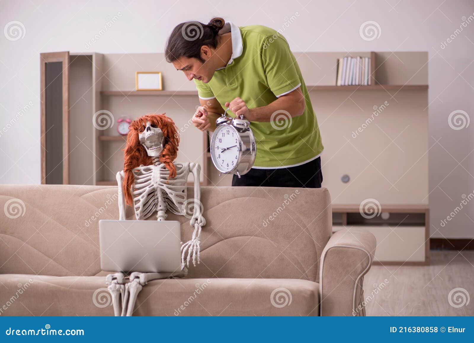 Young Man with Female Skeleton in Time Management Concept Stock Photo ...