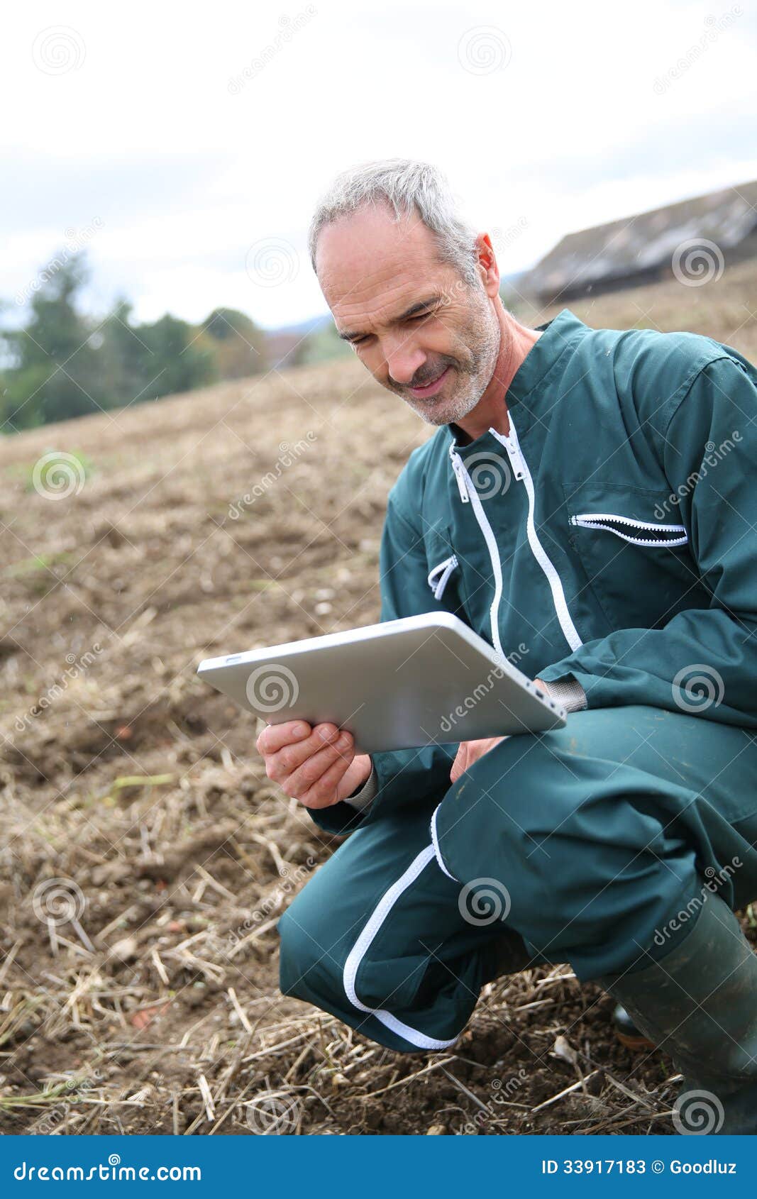 Man in Field Using Tablet for Work Stock Image - Image of senior ...