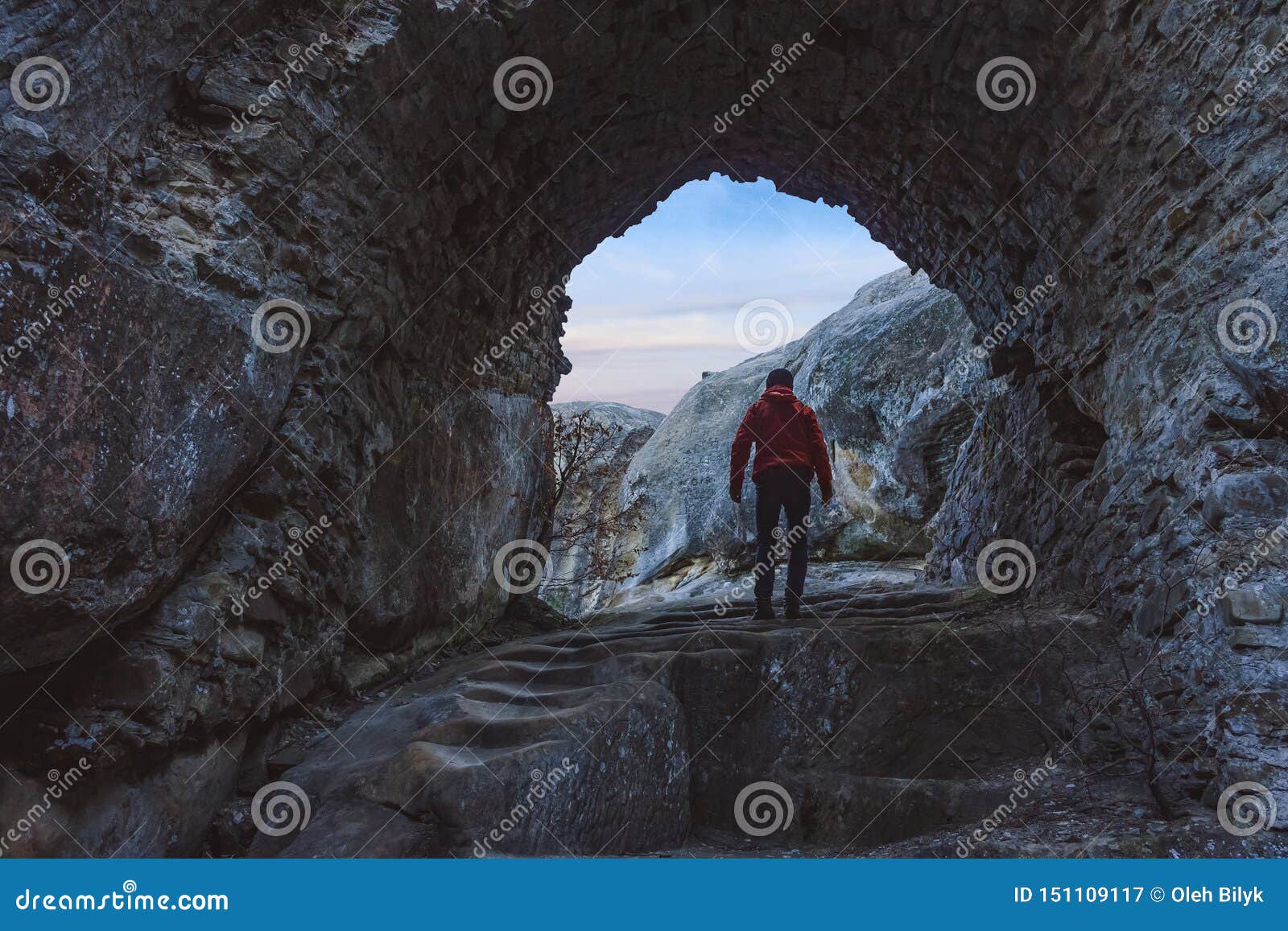 Man Figure Going through the Stone Arch in Sunrise Stock Image - Image ...