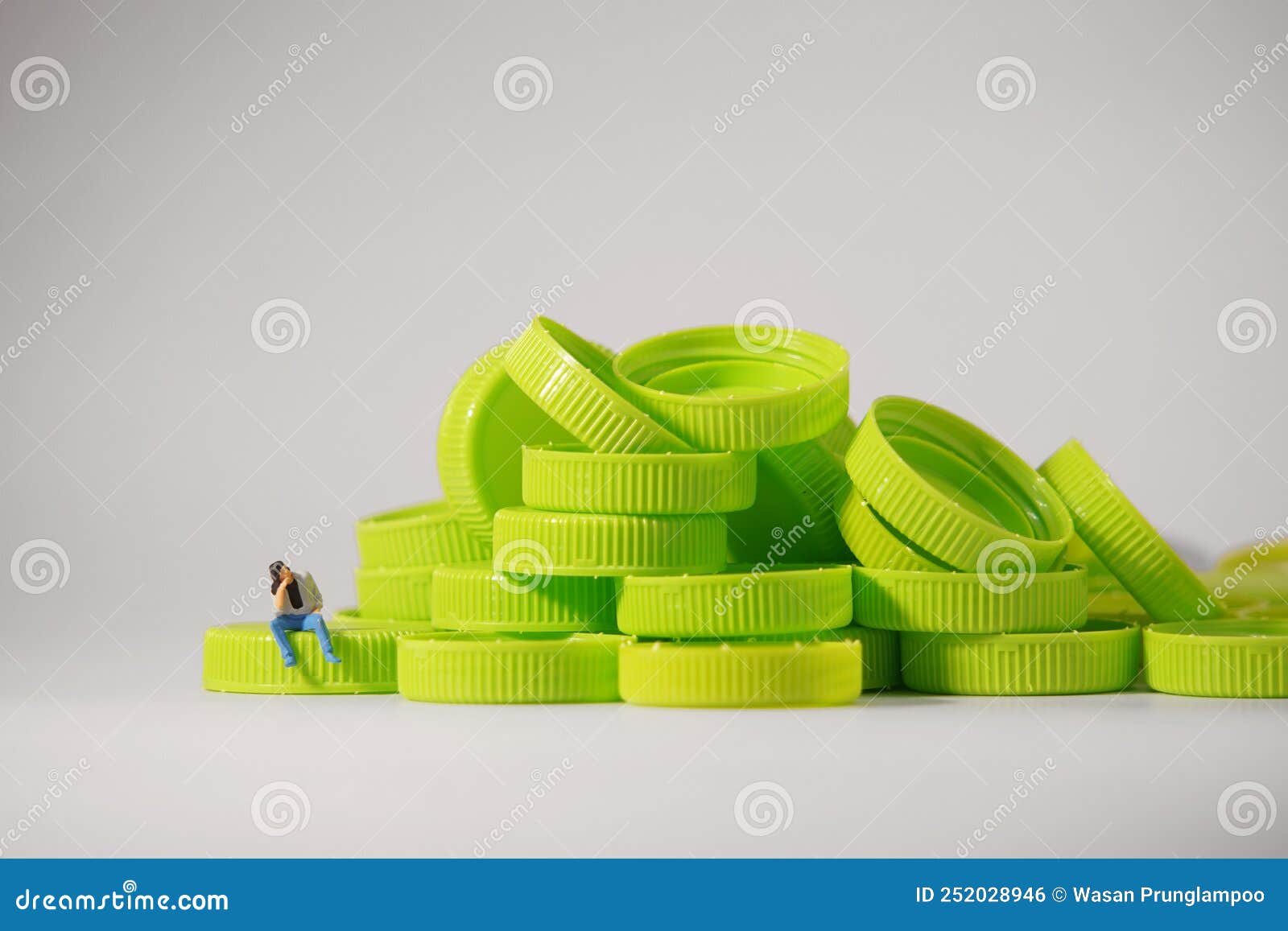 Man Figure Siting on Plastic Cap. Recycle Material Concept Stock Photo ...