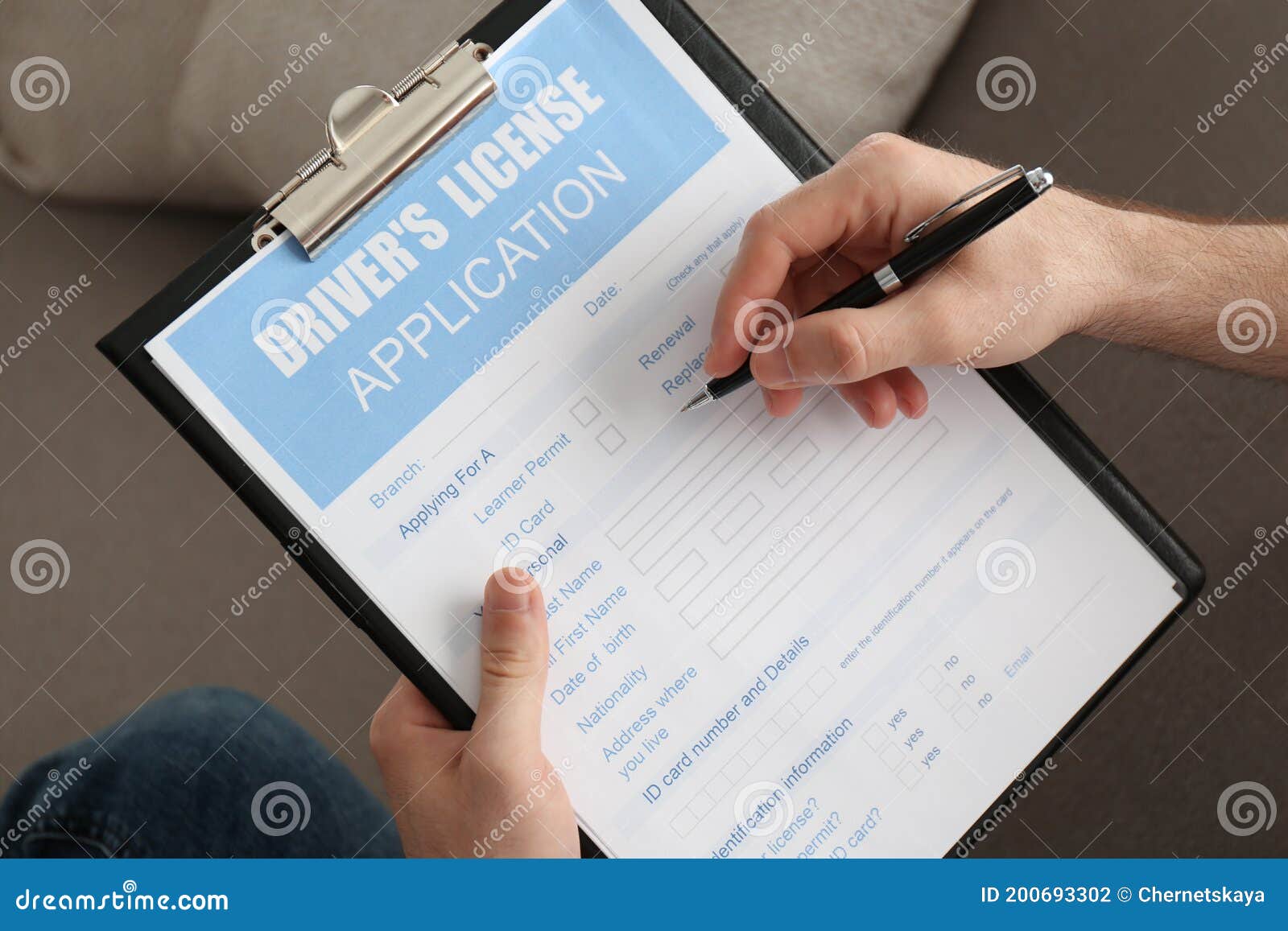 Man Filling in Driver`s License Application Form, Closeup Stock Photo ...