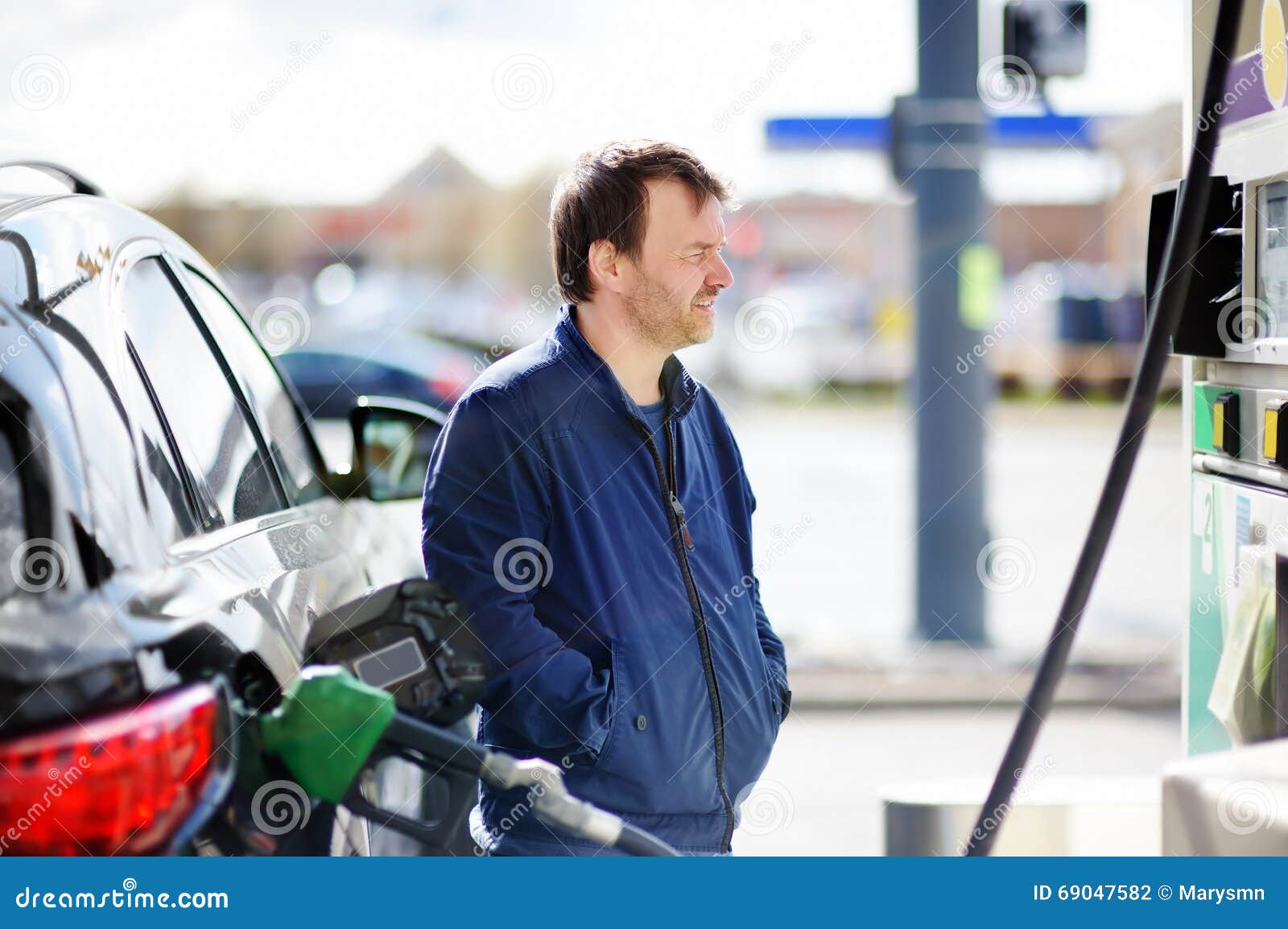 Man filling gasoline fuel stock photo. Image of petroleum - 69047582