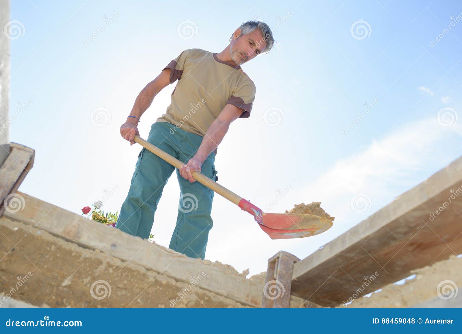 Man filling in grave stock photo. Image of scene, spade - 88459048