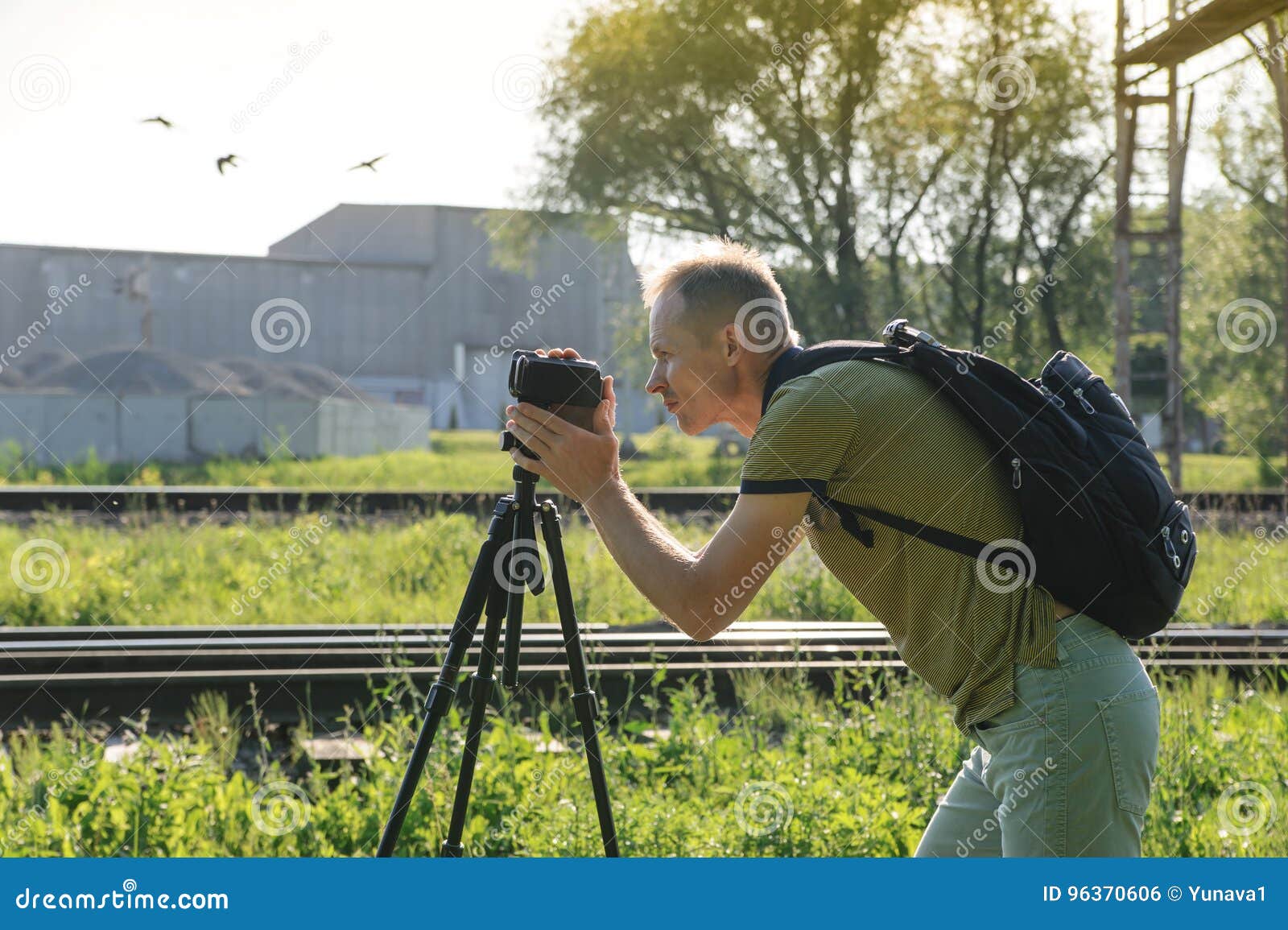 A man is filming outdoor. stock photo. Image of outdoor - 96370606