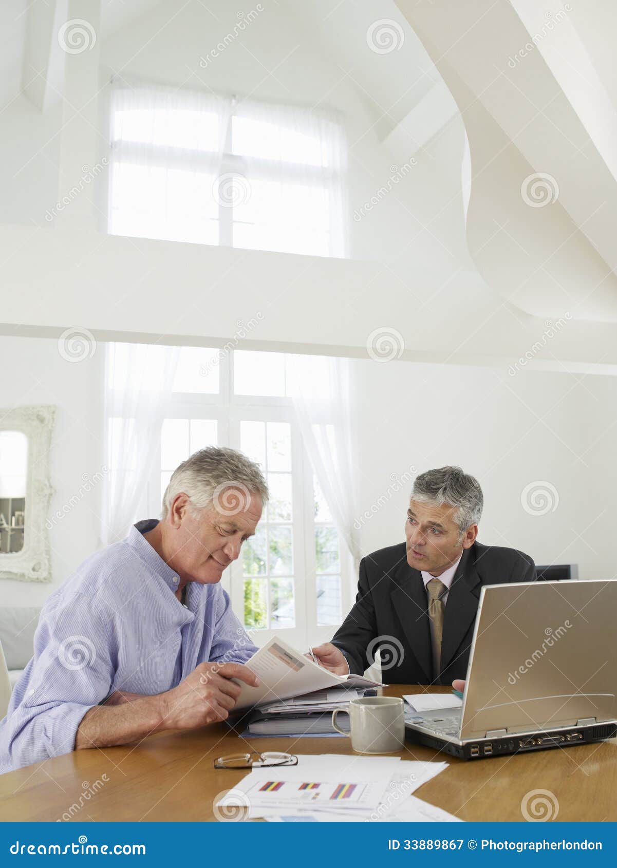 Man with Financial Advisor at Table Stock Image - Image of middle, form ...