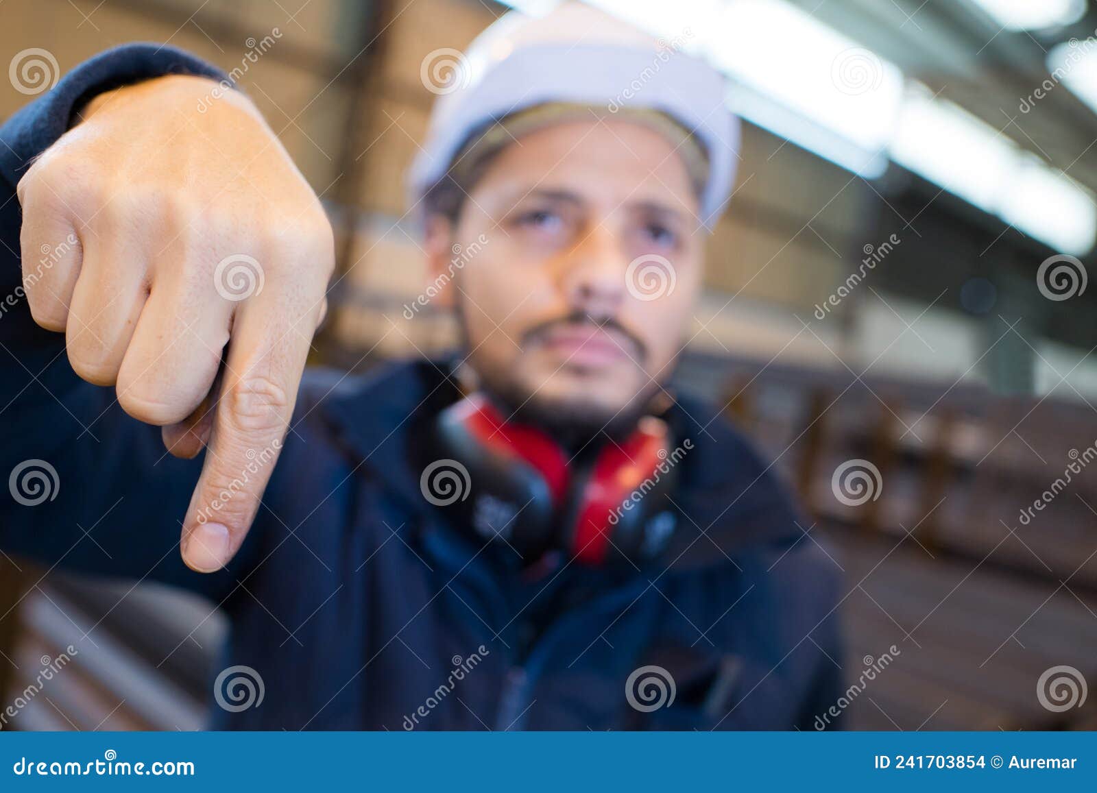 Man with finger down stock photo. Image of person, business - 241703854