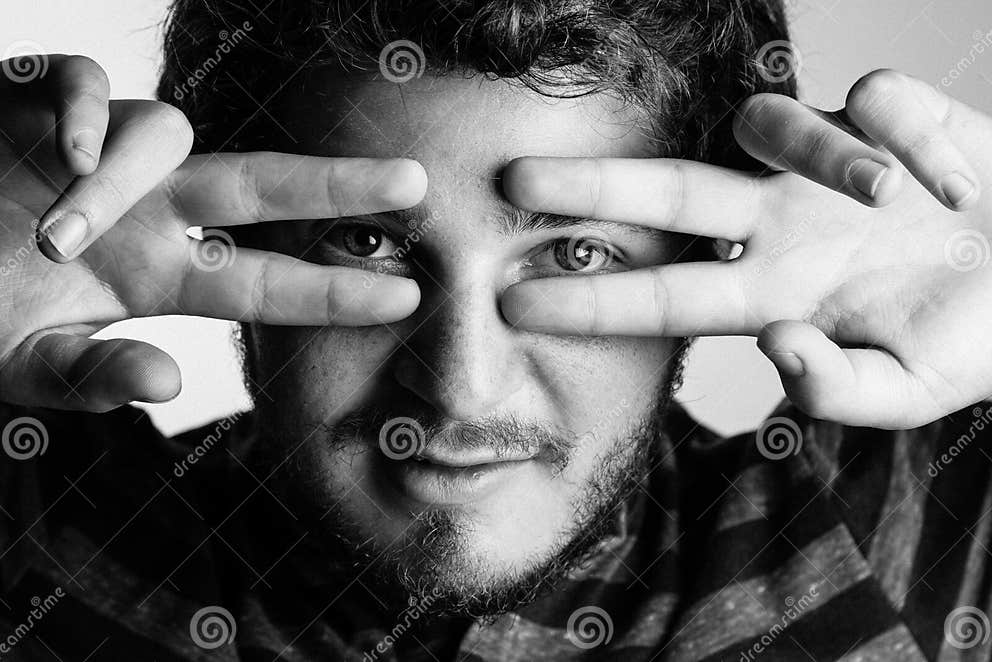 Man with Fingers Around Eyes Stock Image - Image of freckles, smiling ...