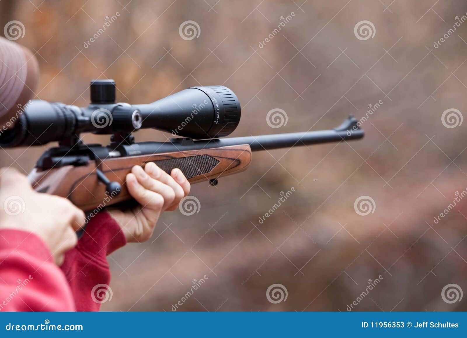 Man Firing a Rifle stock image. Image of firearm, recreation - 11956353