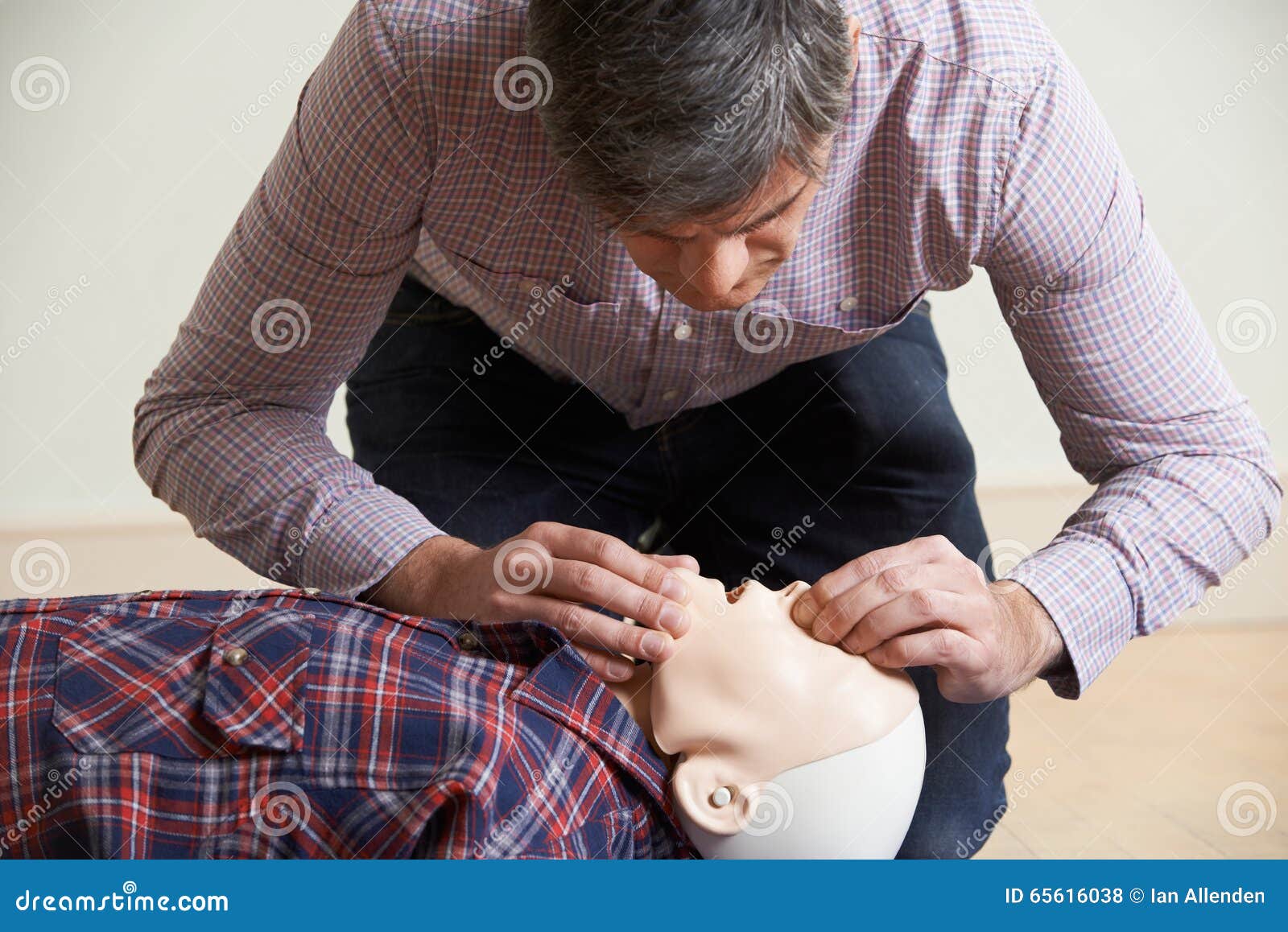 Man in First Aid Class Performing Mouth To Mouth Resuscitation O Stock ...