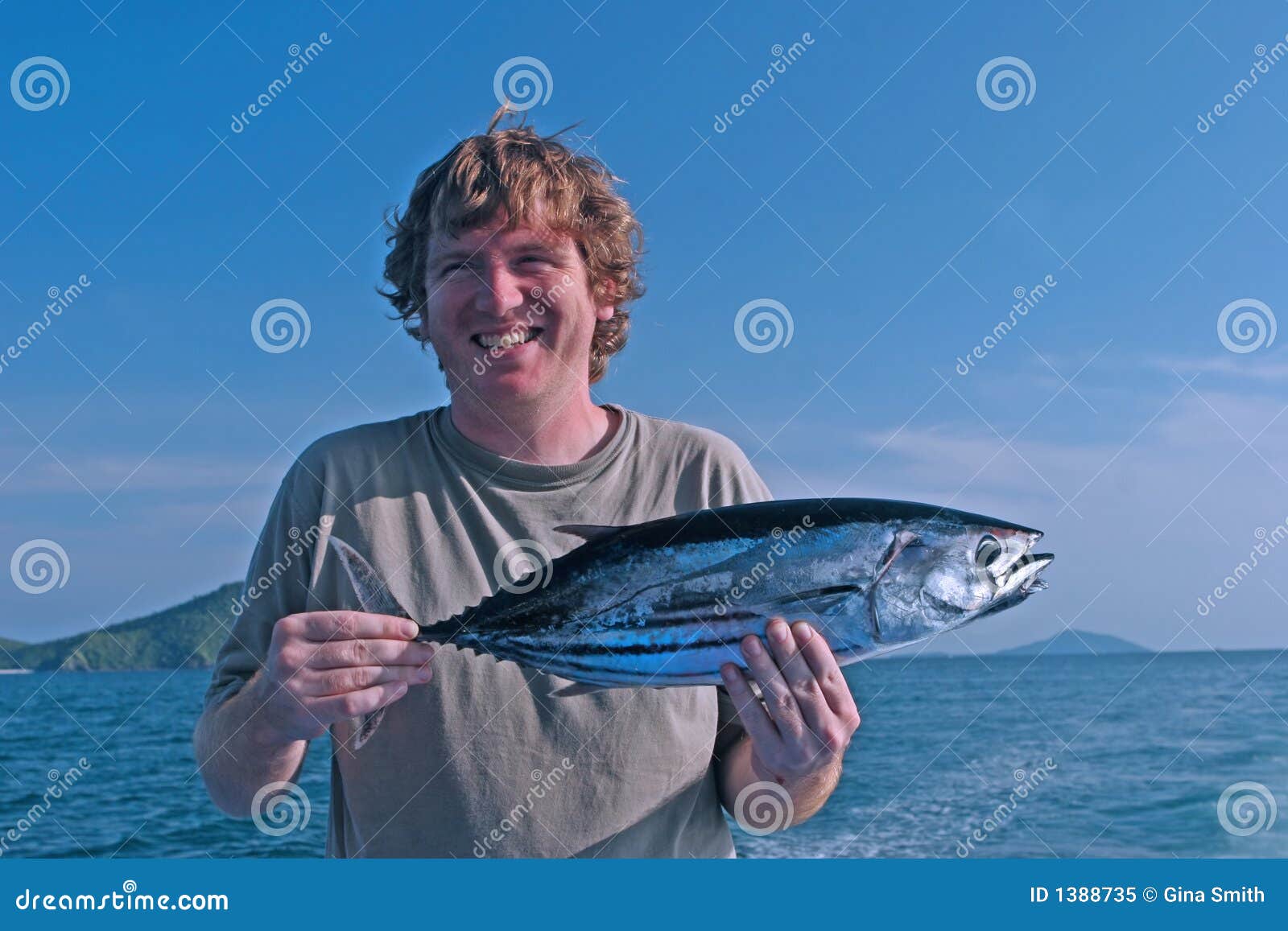 Man with a fish stock image. Image of boat, exotic, beautiful - 1388735