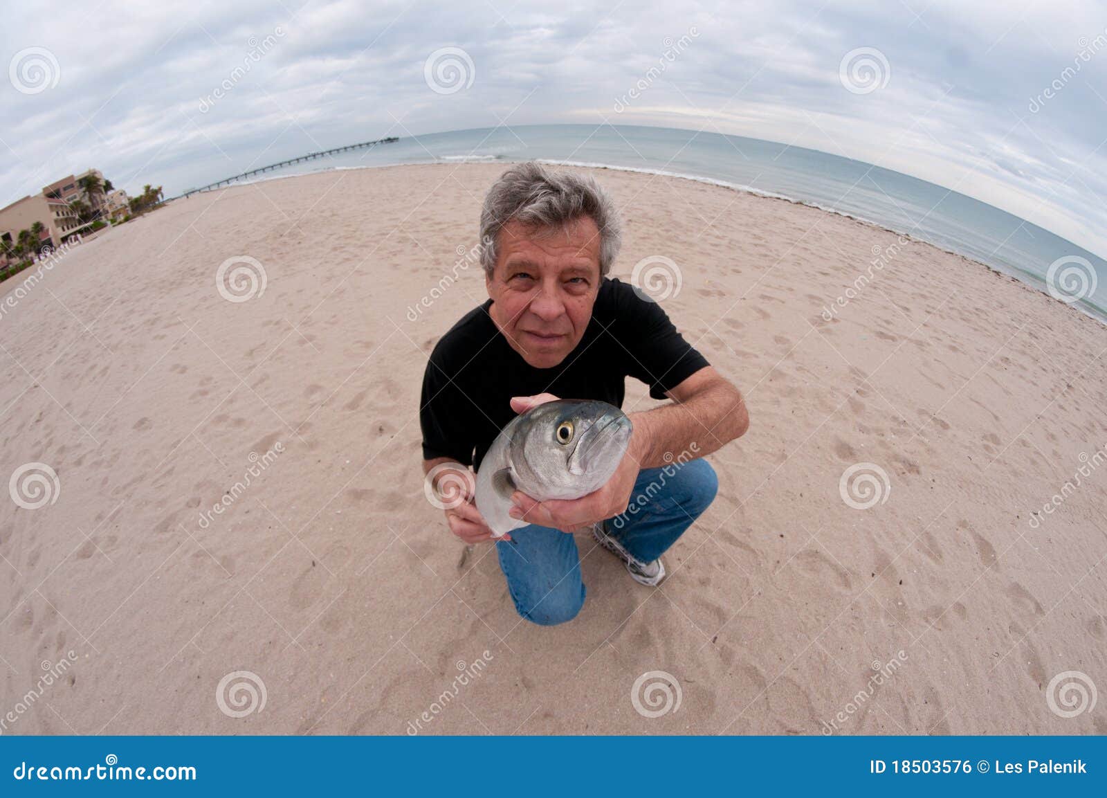 Man with a fish stock photo. Image of water, fish, fisheye - 18503576