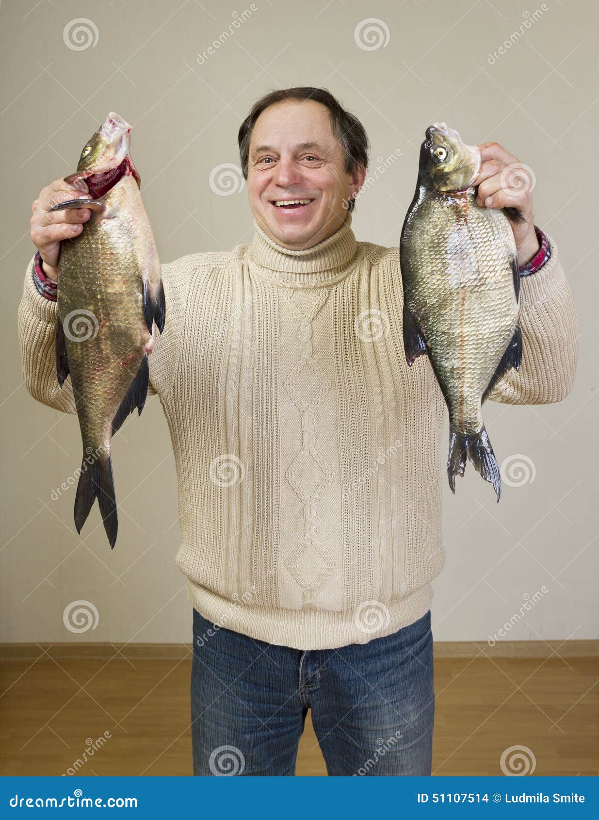 Man with fishes. stock photo. Image of vertical, tench - 51107514