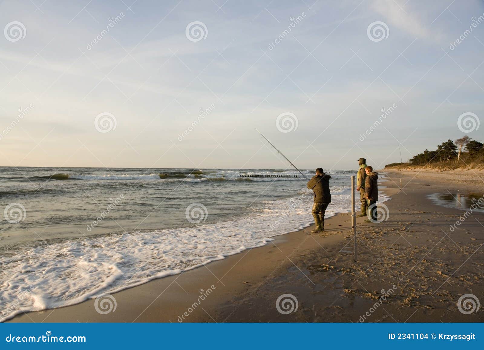 Man fishing on beach stock photo. Image of sundown, recreation - 2341104