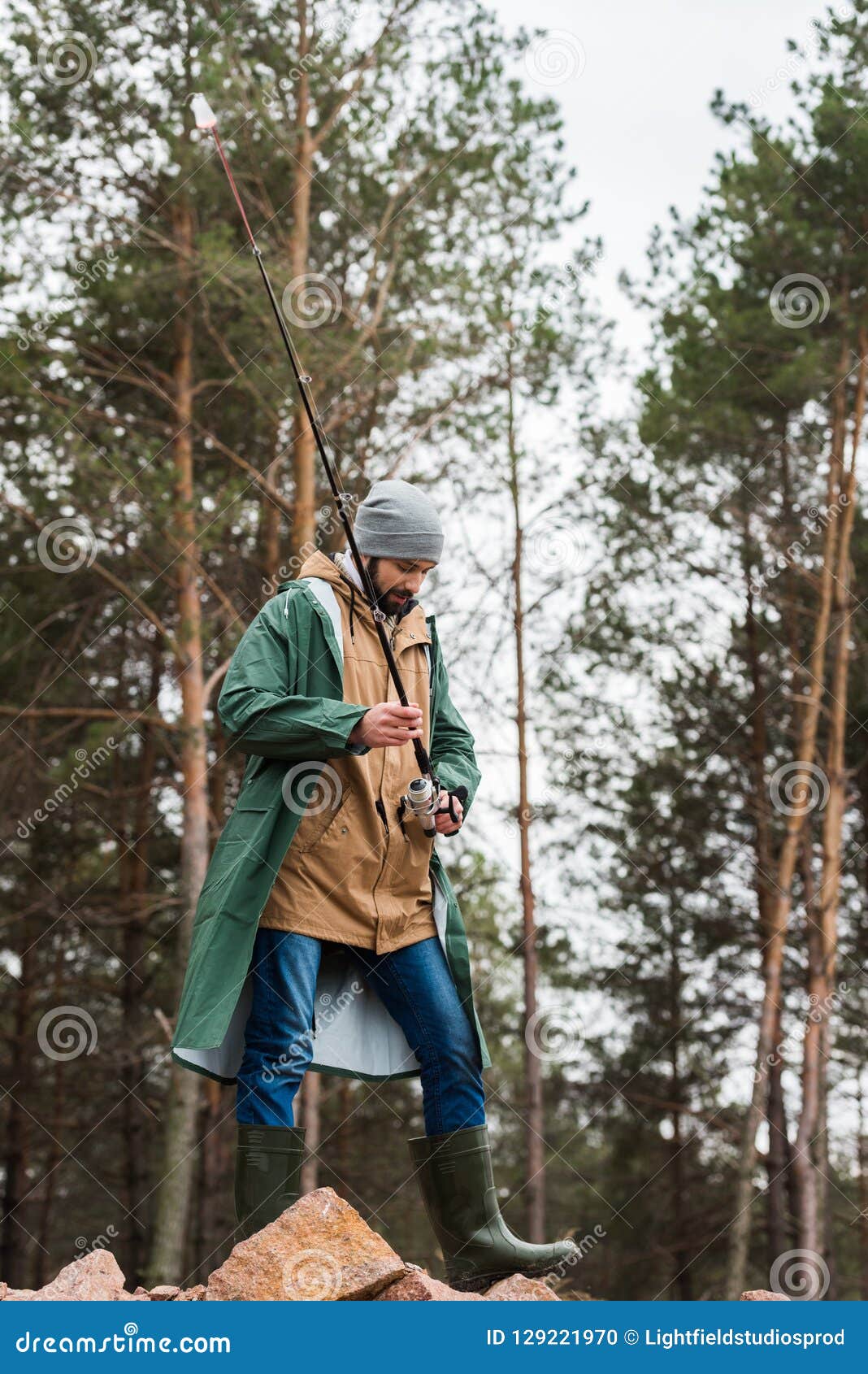 Man with fishing rod stock photo. Image of caucasian - 129221970