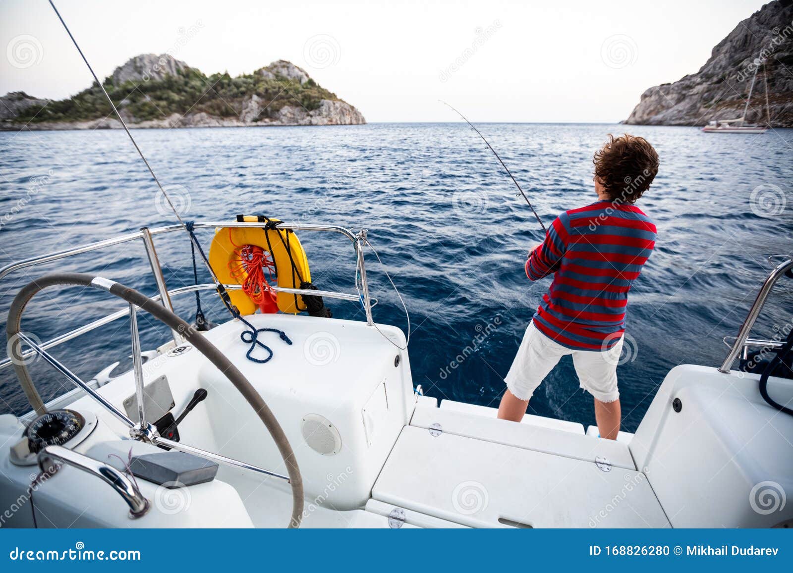 Man fishing in the sea stock photo. Image of rope, rock - 168826280