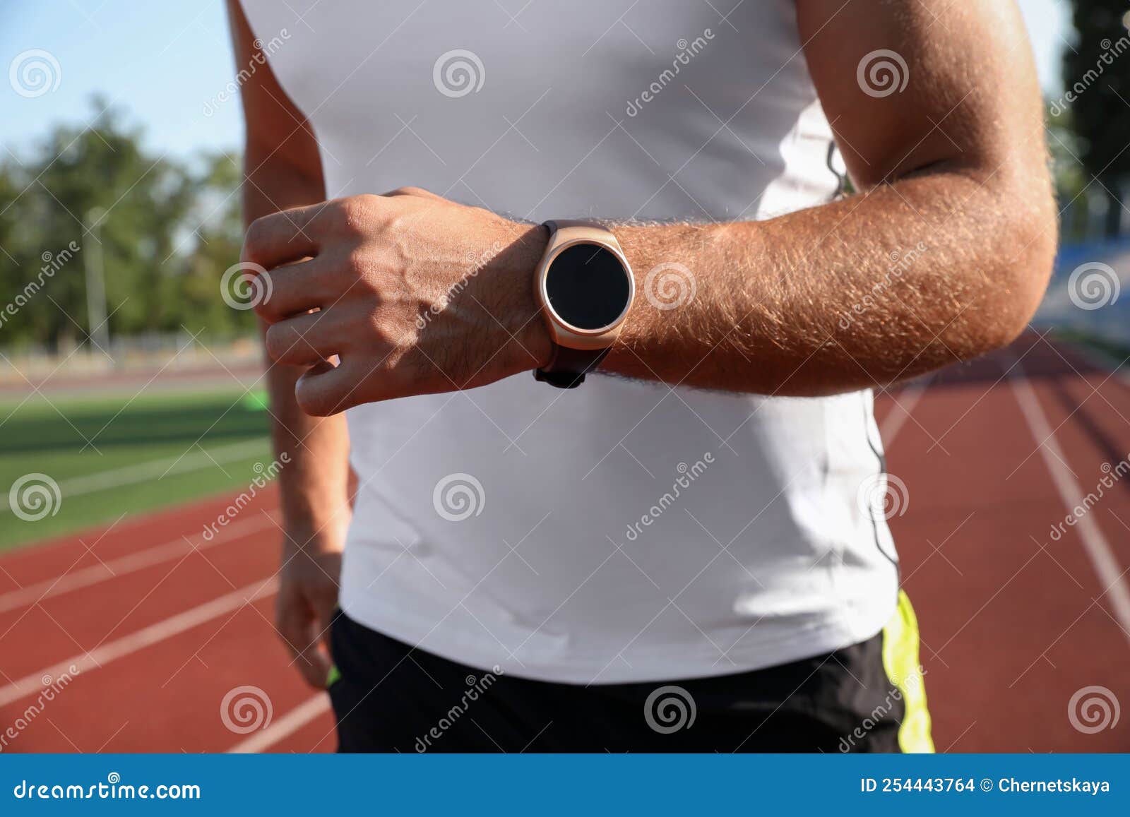 Man with Fitness Tracker Running at Stadium Stock Photo - Image of ...